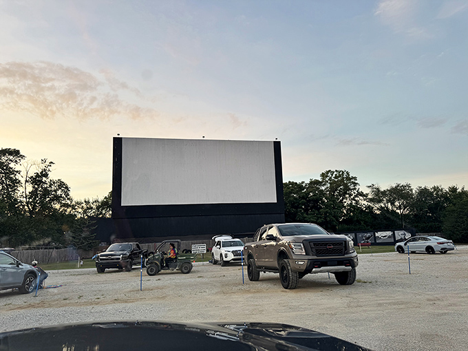 The massive screen awaits the darkness, while trucks and cars claim their spots. Cinema's most democratic venue comes alive at sunset.