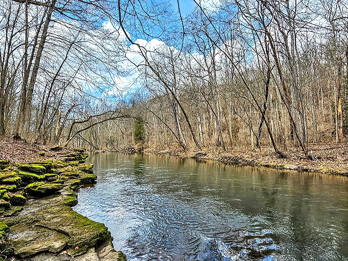 The wooden bridge spanning the Little Miami River offers more than just passage &ndash; it's a front-row seat to nature's quiet symphony of flowing water and rustling leaves.
