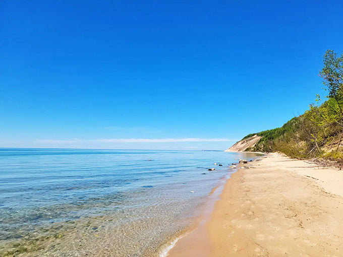 Crystal-clear waters meet golden sand at Peterson Road Beach, where Lake Michigan reveals its Caribbean-like beauty without the passport requirement.