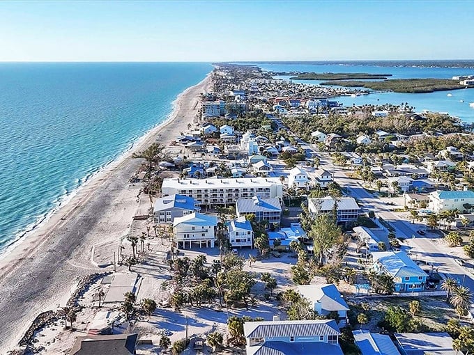 Englewood's coastline stretches like nature's welcome mat – where pastel-colored homes meet turquoise waters and retirement dreams come true without Manhattan price tags.