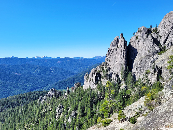 Nature's skyscrapers reach for the heavens at Castle Crags, where 170-million-year-old granite formations stand like ancient sentinels guarding Northern California's wilderness.