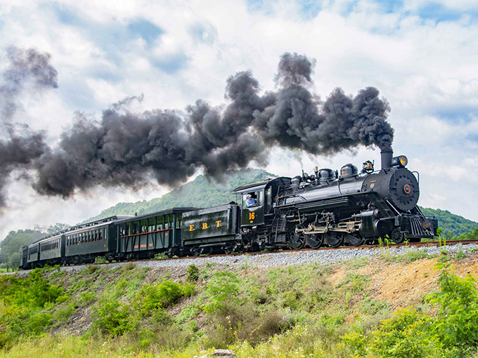Steam and dreams collide as this magnificent locomotive powers through Pennsylvania's countryside, painting the sky with billowing clouds of nostalgia.