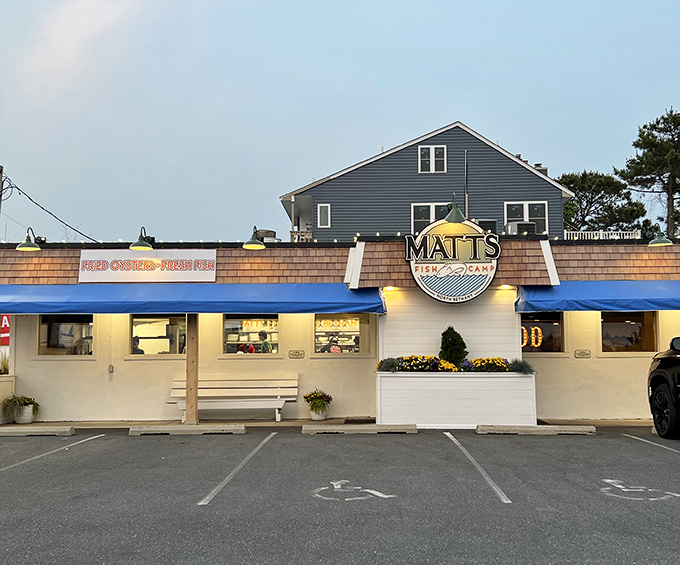 The unassuming blue-awninged exterior of Matt's Fish Camp proves once again that coastal Delaware's best seafood treasures often hide in plain sight.