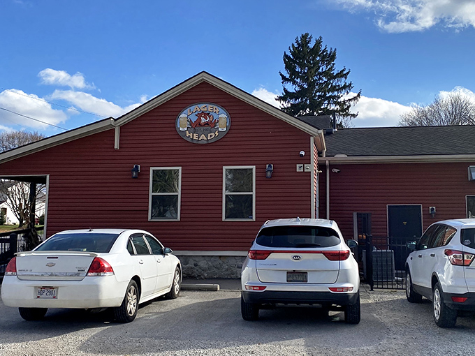 The rustic red exterior of Lager Heads stands like a beacon for BBQ pilgrims. This unassuming building houses smoky treasures worth crossing county lines for.