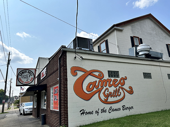 That orange script lettering isn't just signage &ndash; it's a beacon calling cheese lovers home.
