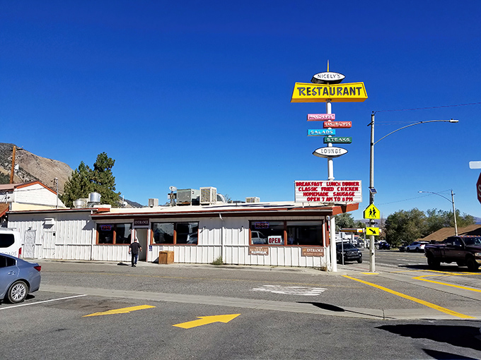 That iconic yellow sign against the Eastern Sierra sky isn't just a beacon for hungry travelers&mdash;it's a promise of comfort food paradise waiting inside.