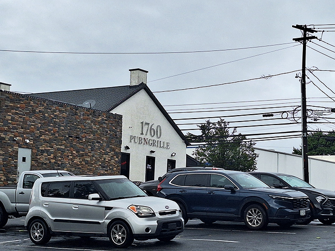The stone-faced exterior of 1760 Pub N Grille stands like a culinary fortress in Trexlertown, promising comfort food treasures within its rustic walls.