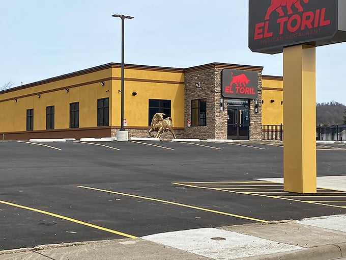 The golden-yellow exterior of El Toril stands proudly with its iconic red bull logo, like a beacon calling hungry travelers from miles around.