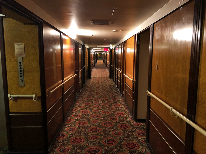 The Queen Mary's haunting silhouette against the Long Beach skyline serves as a reminder that some of history's greatest stories are permanently docked, just waiting for visitors.