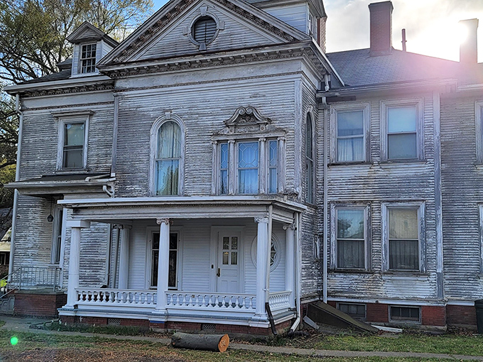 This isn't just another pretty facade &ndash; the Gill House's classical columns and detailed porch railings whisper stories of Gilded Age opulence.