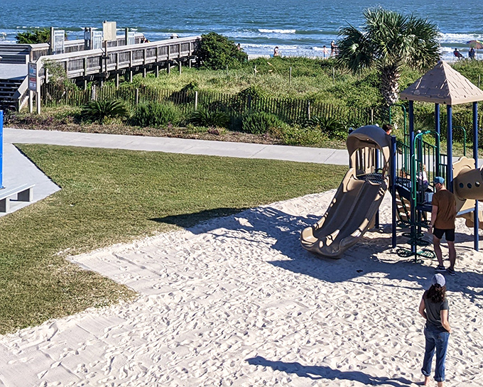 A playground with an ocean view? That's what I call smart real estate. Kids slide and climb while parents secretly envy their carefree joy.