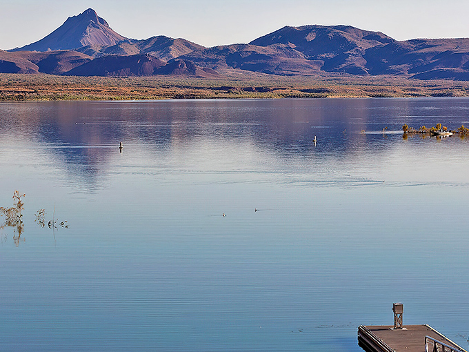 Mirror, mirror on the lake&mdash;who's the fairest view of all? Those mountains reflecting on Alamo's glass-like surface might just win that contest.