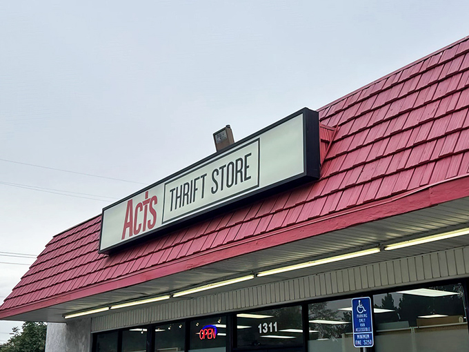 The iconic red roof of ACTS Thrift Store beckons bargain hunters like a lighthouse for the budget-conscious shopper. Treasure awaits inside!