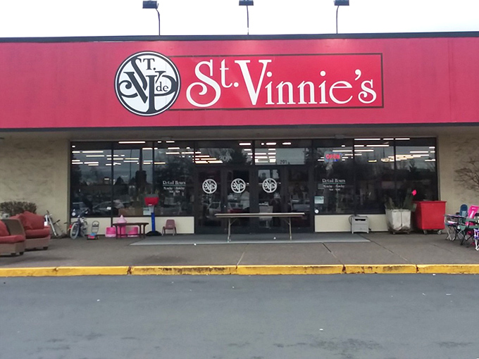 The iconic red storefront of St. Vinnie's beckons like a beacon of bargain-hunting bliss, promising treasures waiting to be discovered inside.