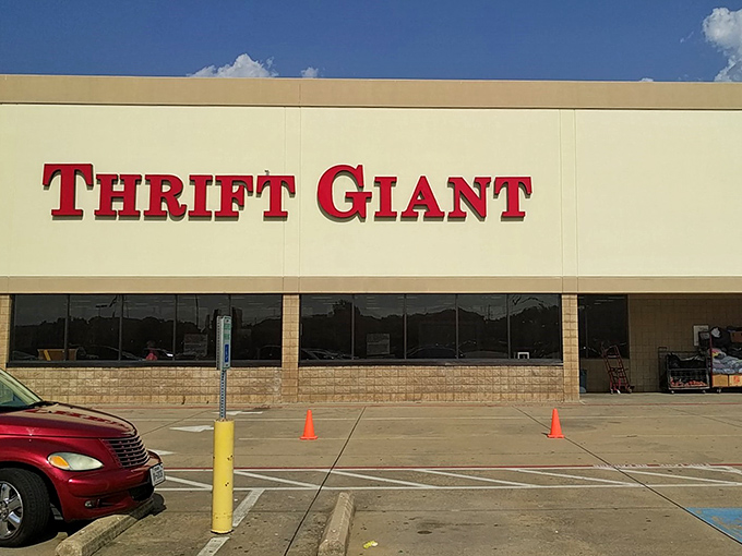 The bold red letters against beige stucco promise adventure within. Like a treasure chest waiting to be unlocked, Thrift Giant beckons bargain hunters. 