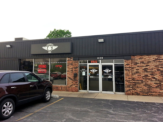 The unassuming exterior of Bombers BBQ proves once again that the best barbecue joints often hide in plain sight, like culinary speakeasies of smoke and spice.