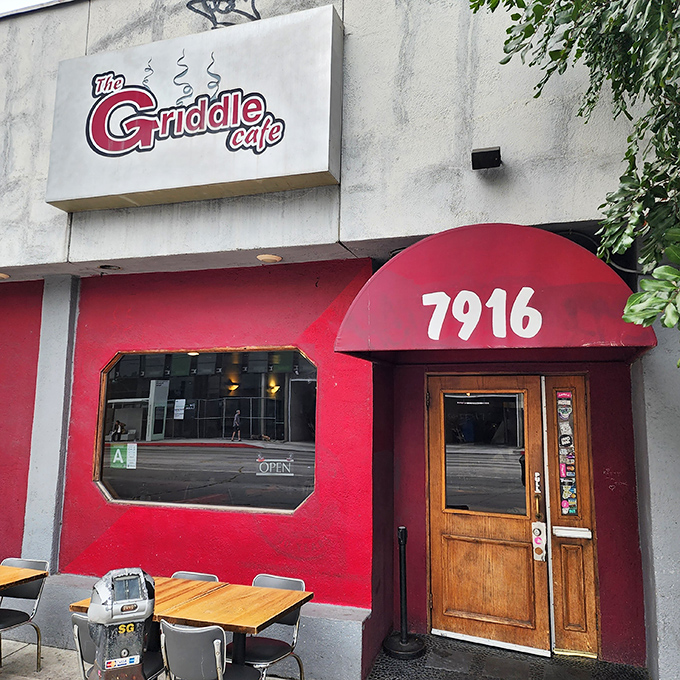The bright red facade of The Griddle Cafe stands out on Sunset Boulevard like a beacon for breakfast enthusiasts. No green juice in sight, just pancake paradise ahead.