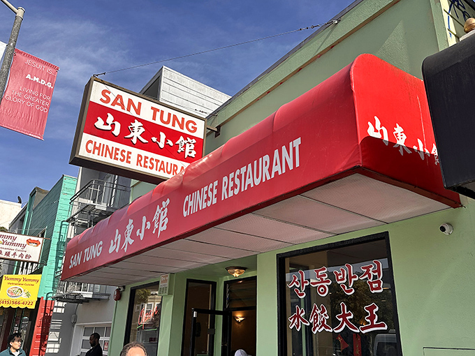 The unassuming mint-green exterior with bright red awning &ndash; San Francisco's culinary equivalent of Clark Kent's phone booth. Transformation happens inside.