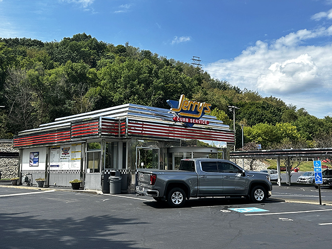 Jerry's Curb Service stands proud like a chrome-wrapped time capsule, ready to serve happiness one milkshake at a time.