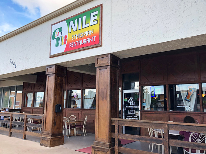 The unassuming storefront of Nile Ethiopian beckons like a culinary oasis in Orlando. Those wooden pillars aren't just supporting the roof&mdash;they're holding up flavor heaven.
