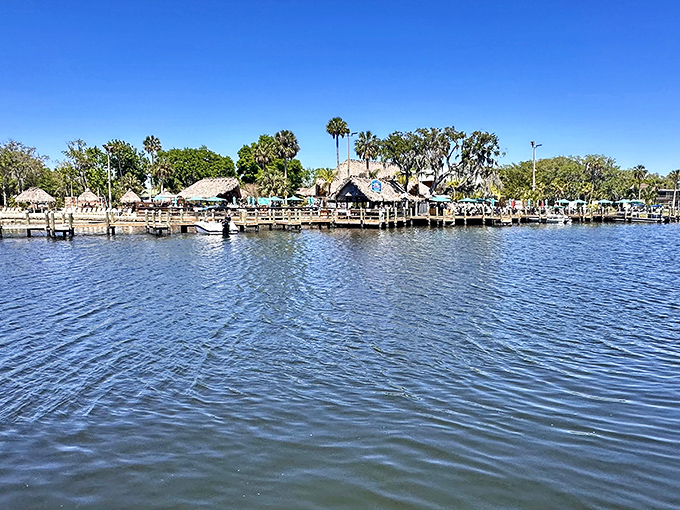 Crystal-clear waters where fishing boats dock like they're auditioning for a postcard competition.