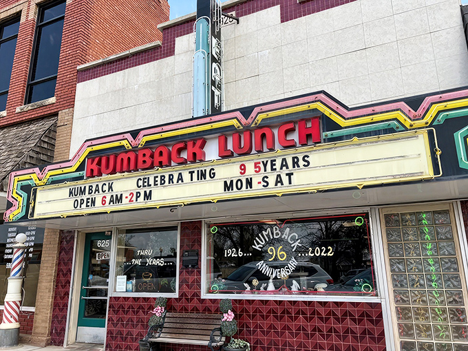 The neon-trimmed marquee of Kumback Lunch stands as a beacon of Americana in Perry, Oklahoma, celebrating nearly a century of hometown cooking.