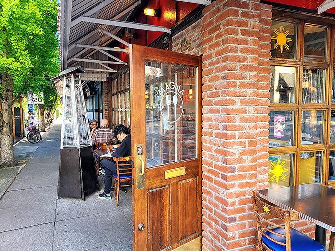 Like a warm invitation written in glass and wood, this storefront whispers promises of Filipino culinary adventures.