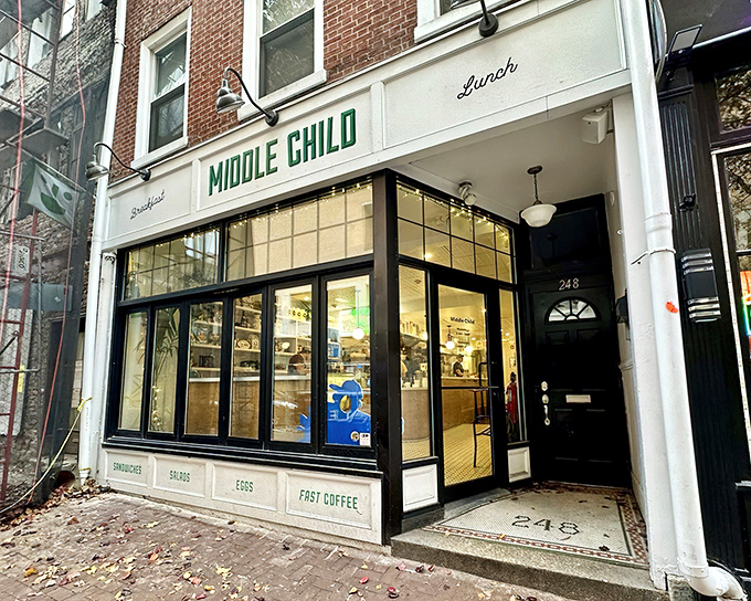 The storefront beckons like a friendly neighbor, with its crisp white facade and bold green lettering promising breakfast delights that'll make your morning infinitely better.