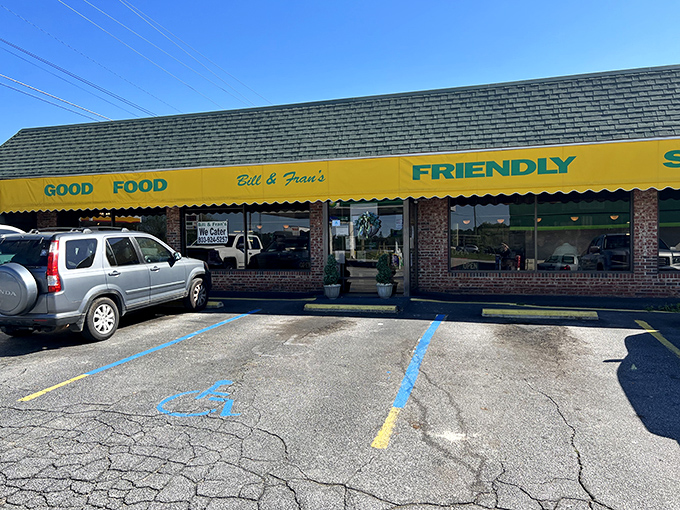The yellow awning promises exactly what you'll find inside: "GOOD FOOD" and "FRIENDLY SERVICE." No marketing department needed when you've got the basics this right.