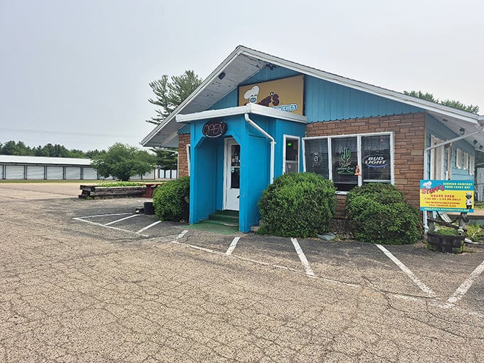 This unassuming blue building houses breakfast dreams that have locals setting their alarms early. The neon "OPEN" sign might as well say "HEAVEN."