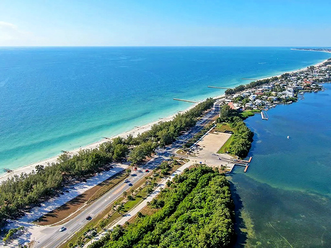 Where turquoise Gulf waters meet residential calm – this aerial view of Cortez showcases Florida's coastal living at its most picturesque.