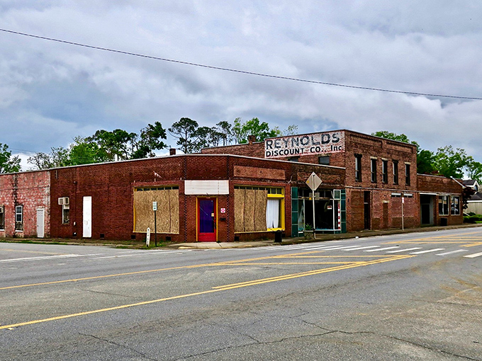 Reynolds Discount Co. stands as a brick sentinel of small-town commerce, its weathered fa&ccedil;ade telling stories of generations who've shopped its aisles.