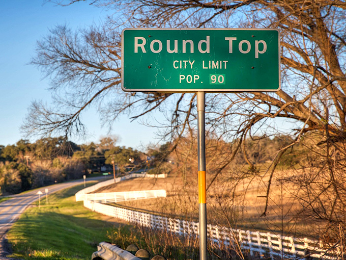 The iconic Round Top city limit sign tells you everything you need to know - population 90, charm factor 1,000,000.