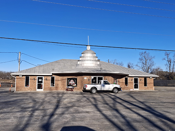 The silver dome gleams against Carolina blue skies, a beacon calling hungry pilgrims from miles around to this temple of traditional whole-hog barbecue.
