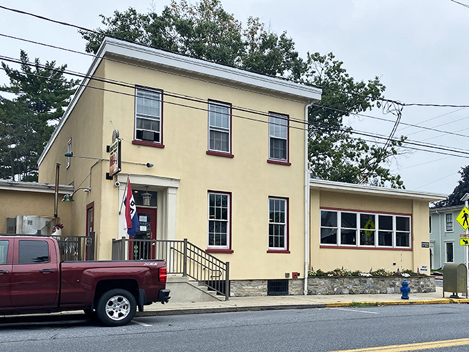 The unassuming yellow exterior of Harvey's Main Street BBQ stands like a beacon of smoky promise on Mount Joy's Main Street.