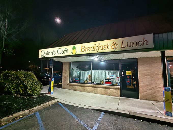 Even after dark, Quinn's iconic sign serves as a beacon for breakfast lovers seeking refuge from fancy food trends.