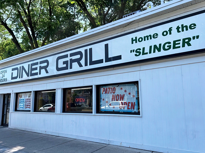 The white facade proudly announces "Home of the SLINGER" &ndash; a promise that's both a challenge and a comfort to Chicago night owls and early birds alike.