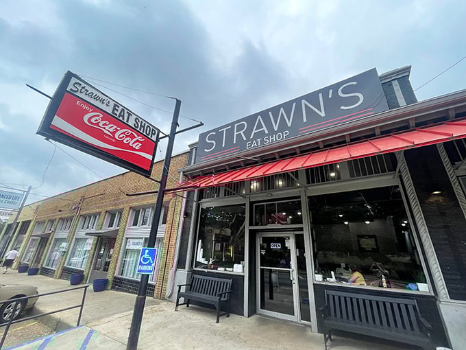 The unassuming exterior of Strawn's Eat Shop, with its vintage Coca-Cola sign, promises the kind of authentic experience that food travel shows hunt for.