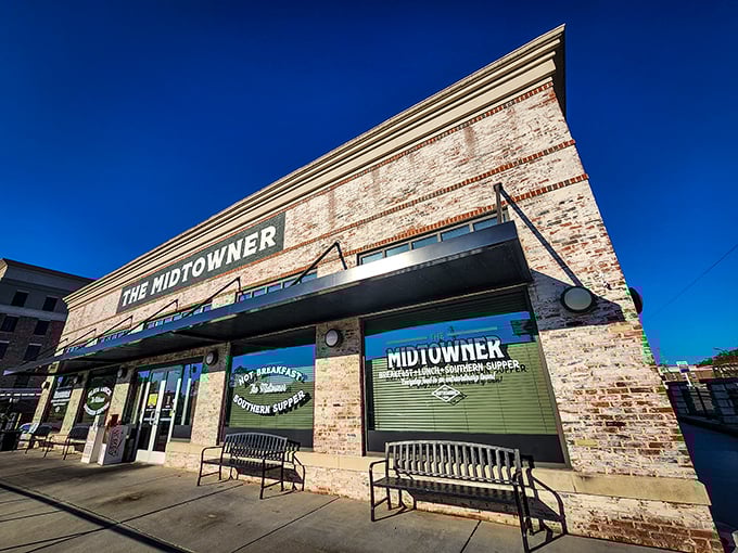 The Midtowner's striking brick exterior stands like a beacon of breakfast hope against Hattiesburg's blue sky. Comfort food paradise awaits inside.