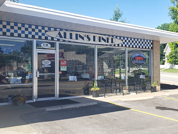 The blue-checkered facade of Allin's Diner promises no-nonsense breakfast magic, like finding the diner equivalent of Narnia in suburban St. Charles.