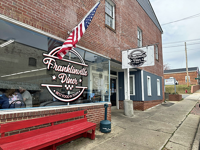 The American flag stands proud outside this brick-faced treasure – Franklinville Diner promises "Best Food in Town" and delivers on that patriotic pledge.