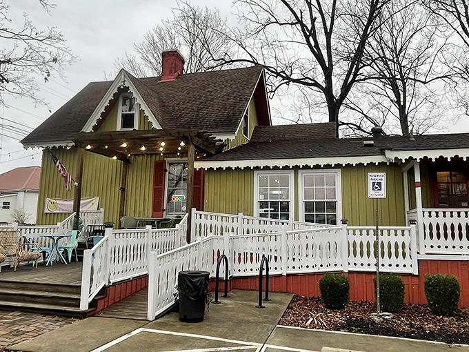 Even on cloudy days, this cheerful green farmhouse glows with promise, its wraparound porch practically whispering, "Come sit a spell."