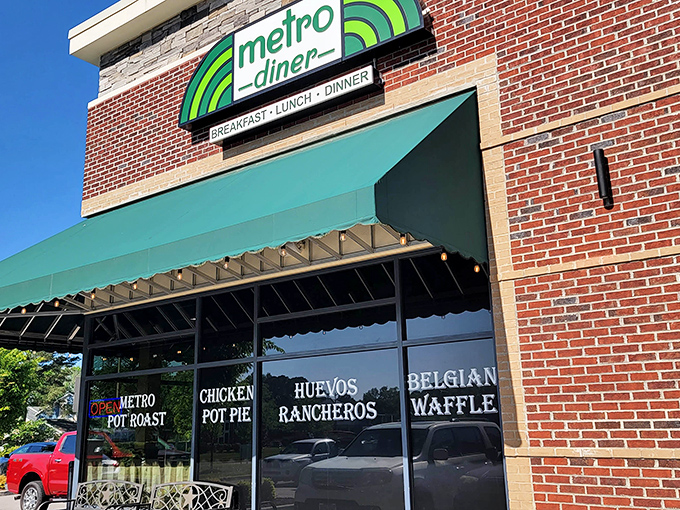 Metro Diner's brick facade and emerald awning stand like a beacon of breakfast hope on Volvo Parkway. Comfort food paradise awaits!