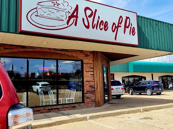 The humble exterior of A Slice of Pie glows like a beacon in the night, promising sweet salvation for dessert lovers passing through Rolla.