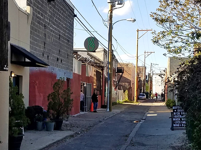 Down this humble Fishtown alley lies pizza nirvana, where the green peace sign beckons hungry pilgrims to their doughy destiny.