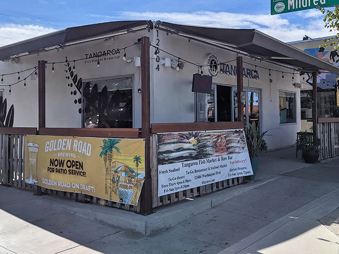 String lights and weathered wood create that perfect "I've discovered something special" vibe that makes you want to text your foodie friends immediately.