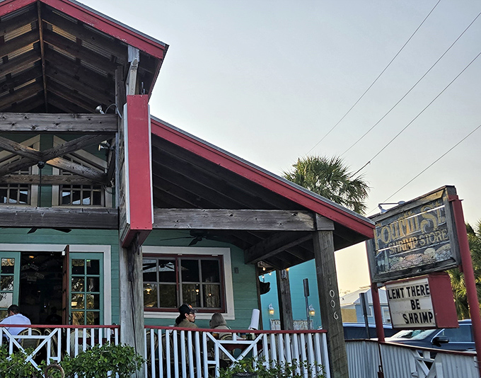The turquoise beacon of seafood salvation! Fourth Street Shrimp Store's charming exterior, with its weathered wood and palm trees, promises Florida dining at its most authentic.