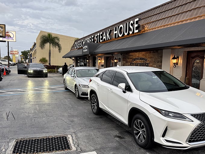 The unassuming exterior of Okeechobee Steak House belies the culinary treasures within. Like finding a diamond in a strip mall.