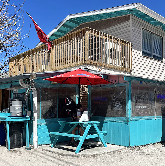 The turquoise beacon of burger bliss stands proudly on Anna Maria Island, promising simple pleasures and island vibes.
