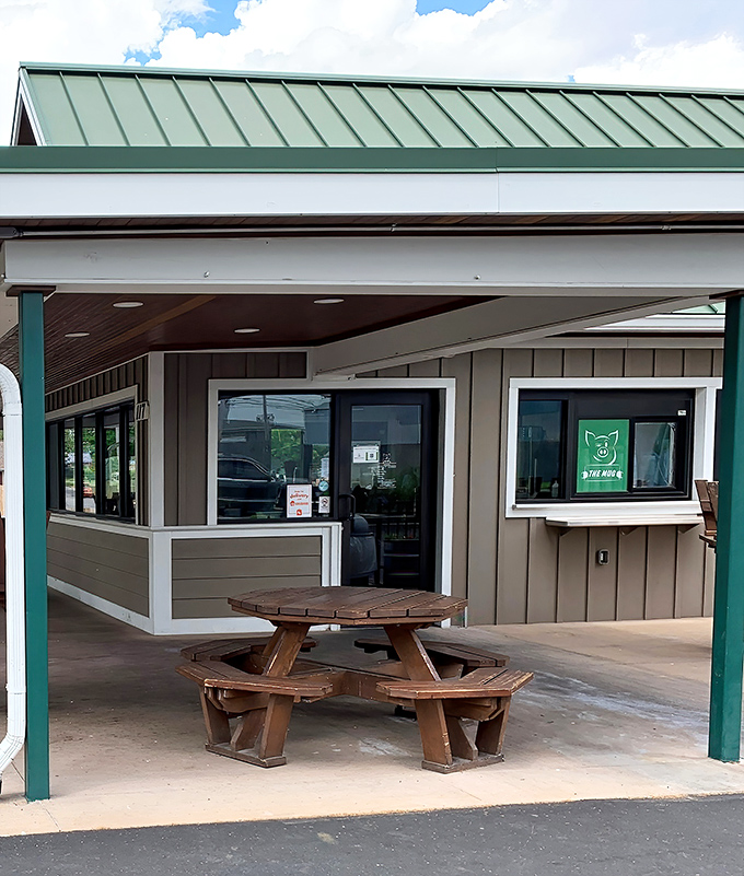 The unassuming exterior of The Mug proves once again that the best food experiences often hide behind the simplest facades. That wooden picnic table is calling your name.